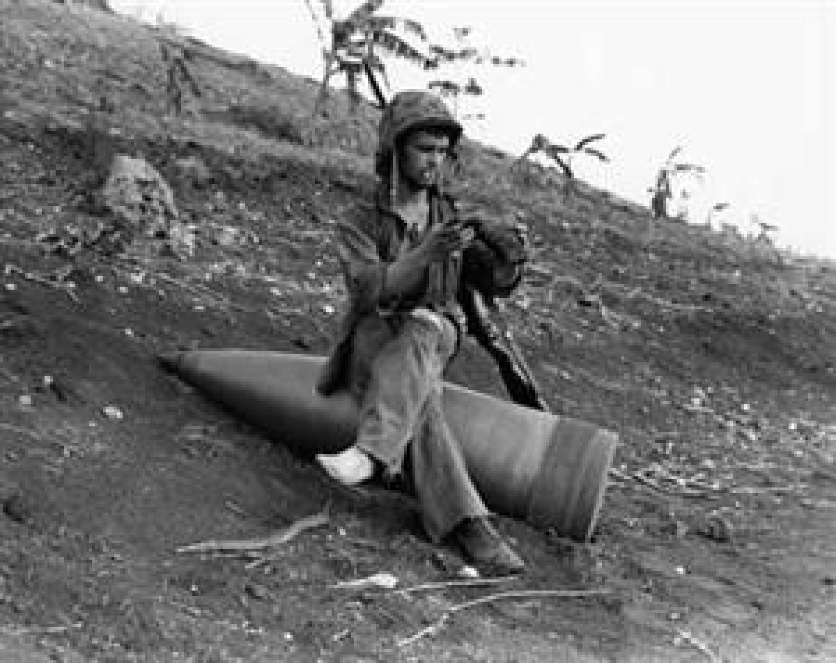 From Our Archive: 1944 Marine on Unexploded Shell | Proceedings - May ...